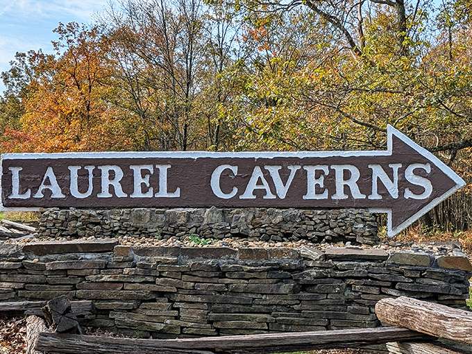 Follow the arrow to underground wonders! This rustic sign has pointed thousands of curious explorers toward unforgettable subterranean adventures.
