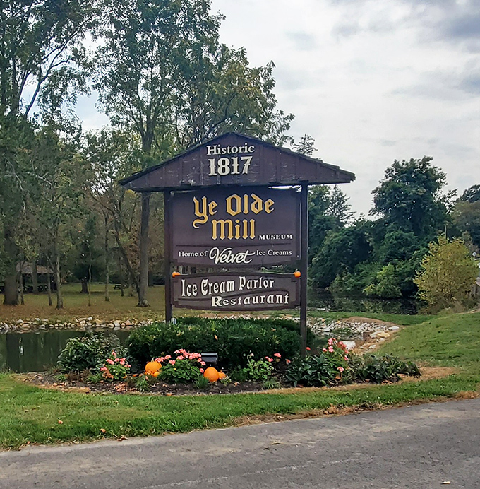 "Historic 1817" proudly announces the sign, standing sentinel over a pond that reflects both the mill's history and your ice cream intentions.