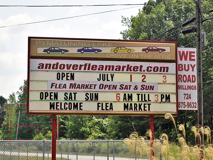 The marquee announces operating hours with nostalgic charm, sharing space with the Pymatuning Lake Drive-In&mdash;two American classics coexisting perfectly.