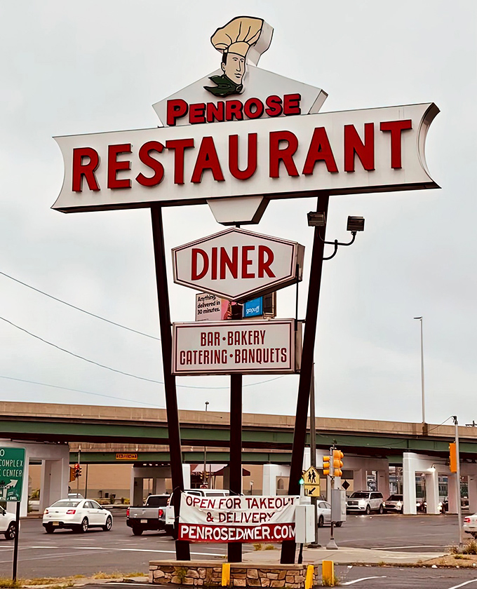 The classic diner sign that beckons hungry souls from blocks away with promises of satisfaction.