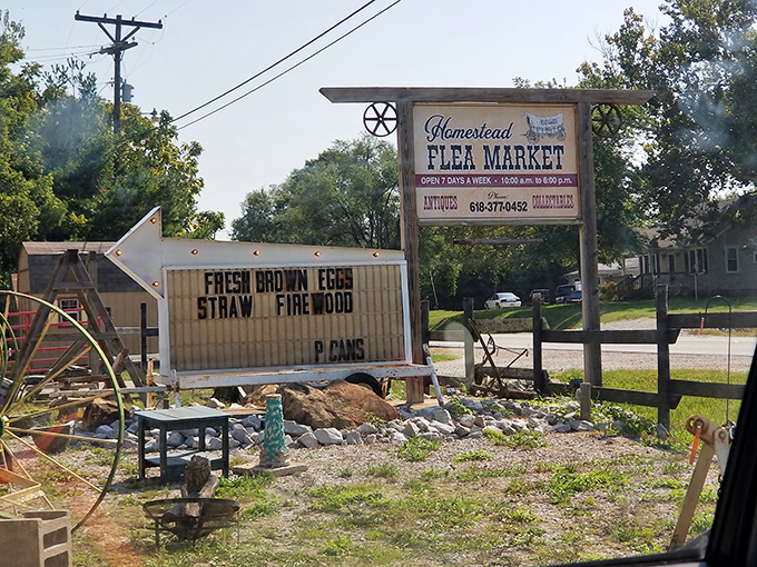 The rustic sign that started countless treasure hunts. Fresh brown eggs advertised alongside antiques&mdash;only at Homestead Flea Market.