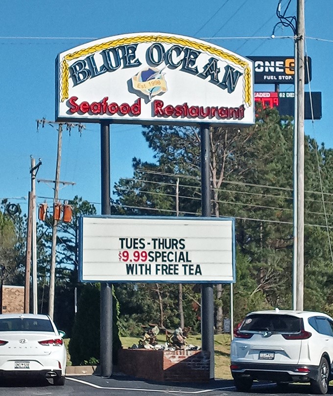 That roadside sign is like a lighthouse guiding hungry travelers to safe harbor. The $9.99 special with free tea is the siren song no one can resist.
