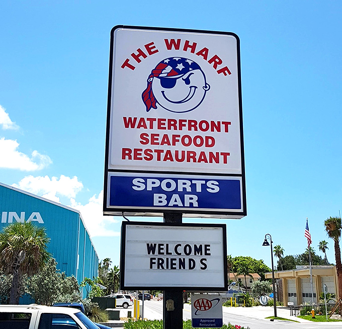 The sign says "Welcome Friends" because at The Wharf, you arrive as customers but leave as part of the extended seafood family.
