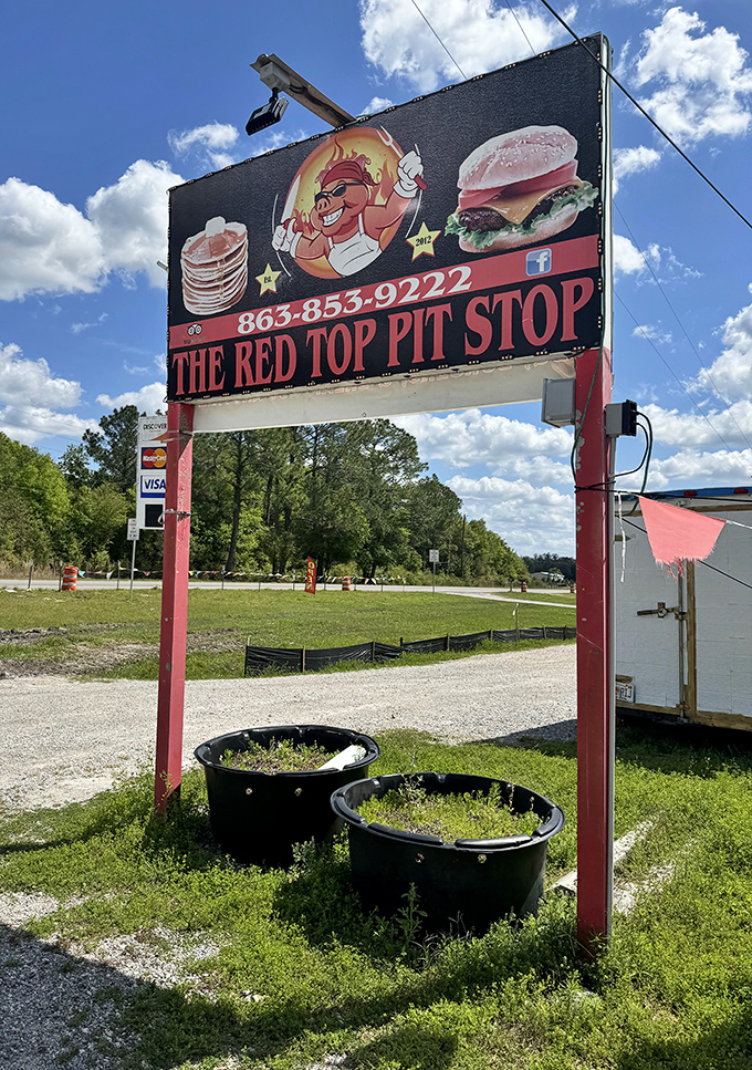 A sign that promises exactly what awaits inside. Like a BBQ bat signal calling hungry heroes from miles around.