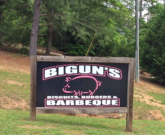 The roadside sign promises the holy trinity of Southern cuisine: biscuits, burgers, and barbecue &ndash; a trifecta of comfort that delivers.