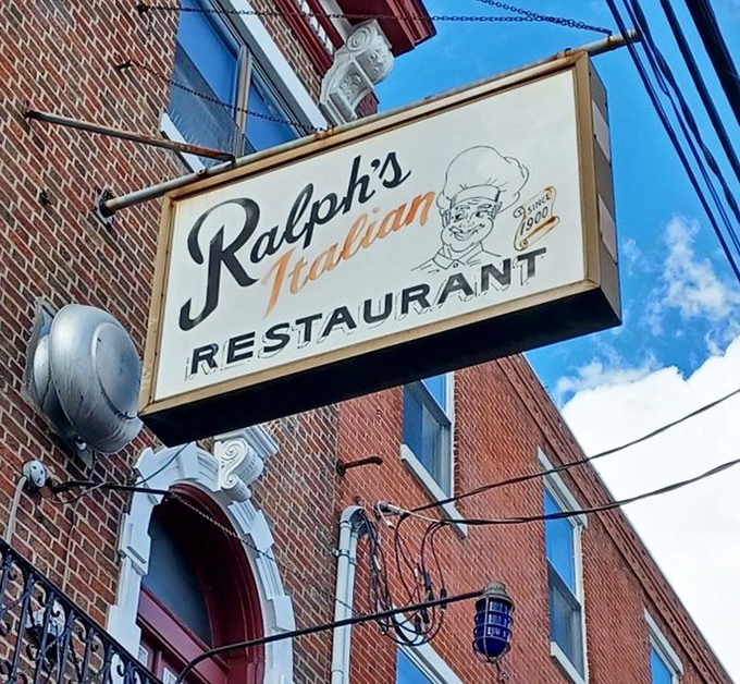 The vintage sign stands as a neighborhood landmark. That illustrated chef has been winking at passersby and promising delicious meals for decades.