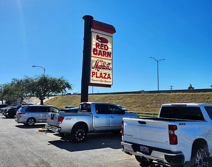 The iconic Red Barn sign stands tall against Florida's blue sky. Your car knows the way here, even when you're just "stopping by for a quick look."