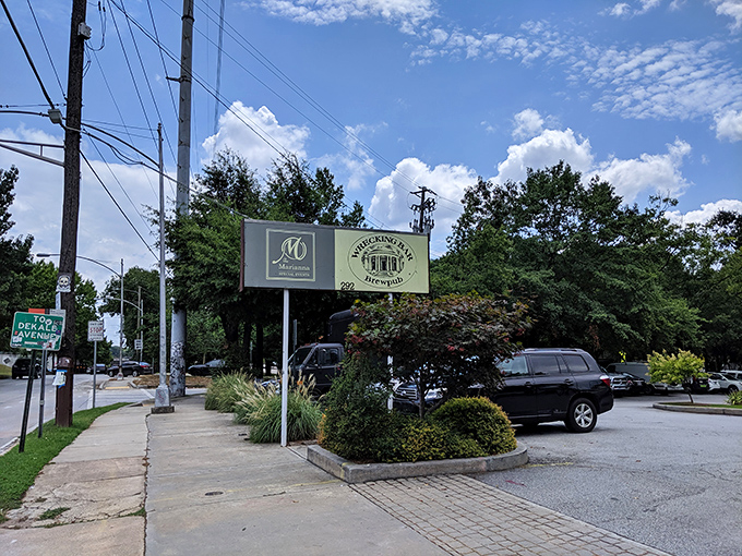 The sign stands as a beacon for hungry travelers, promising craft beer salvation just steps away from Atlanta's bustling streets.