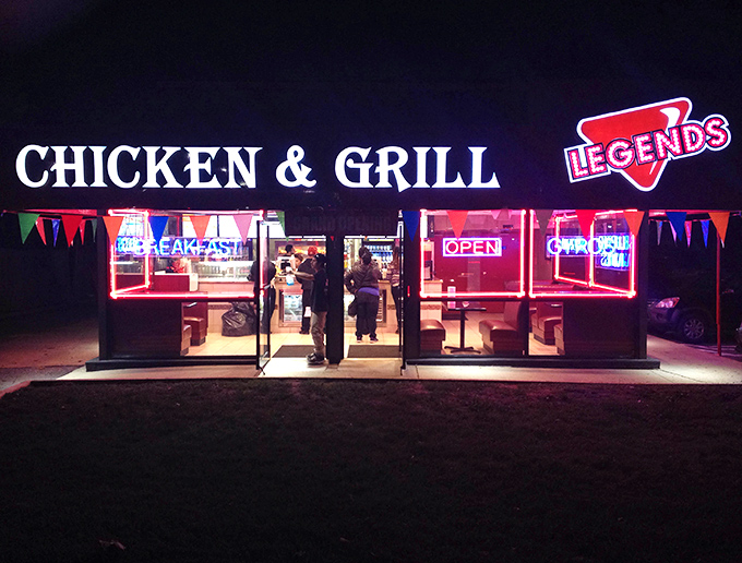 The nighttime signage doesn't whisper, it announces: "Yes, we're open, and yes, this chicken is worth staying up for."