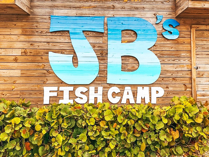 That ombr&eacute; blue sign against weathered wood is more than decoration&mdash;it's a beacon calling hungry travelers home to seafood paradise.