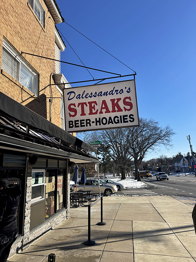 The classic Dalessandro's sign against a blue sky &ndash; a beacon of hope for the hungry, a landmark for the locals, and a promise of deliciousness.