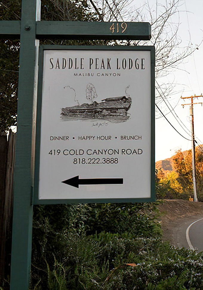 The sign points the way to culinary adventure. Like all great treasures, Saddle Peak Lodge requires a bit of seeking to discover.
