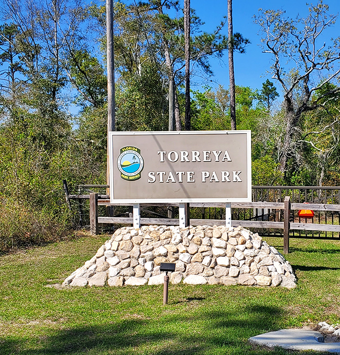 The entrance sign that promises: beyond this point, you're entering a Florida most tourists never see. No mouse ears required.