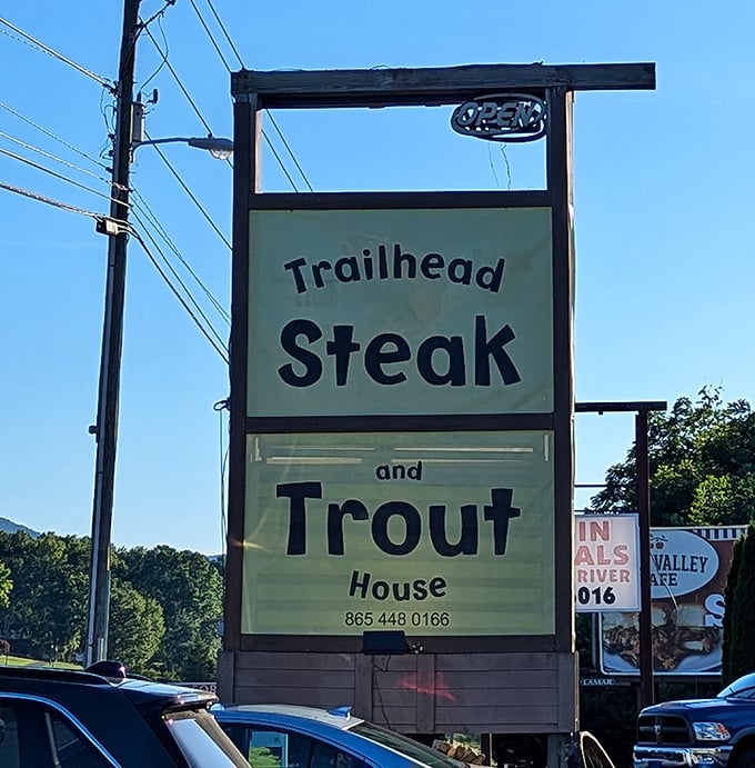The roadside sign stands tall against the Tennessee sky, a beacon of hope for hungry travelers seeking carnivorous salvation.