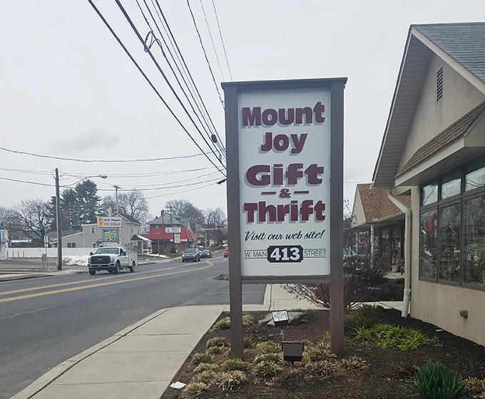 The roadside sign that beckons bargain hunters like a lighthouse guiding ships to shore. Your wallet's safe harbor awaits inside.