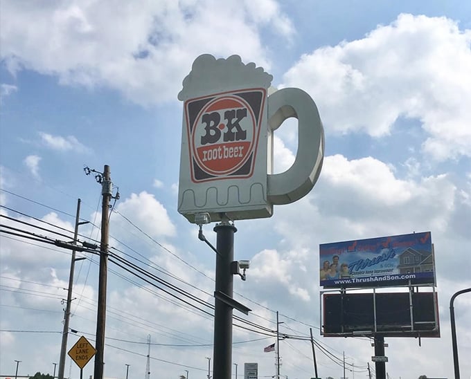 The iconic B & K mug sign stands tall against Ohio skies, a beacon of root beer excellence that's impossible to drive past.