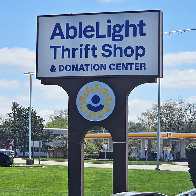 The AbleLight sign stands proud against a blue Illinois sky. Not just a thrift store, but a beacon for bargain hunters and community supporters alike.
