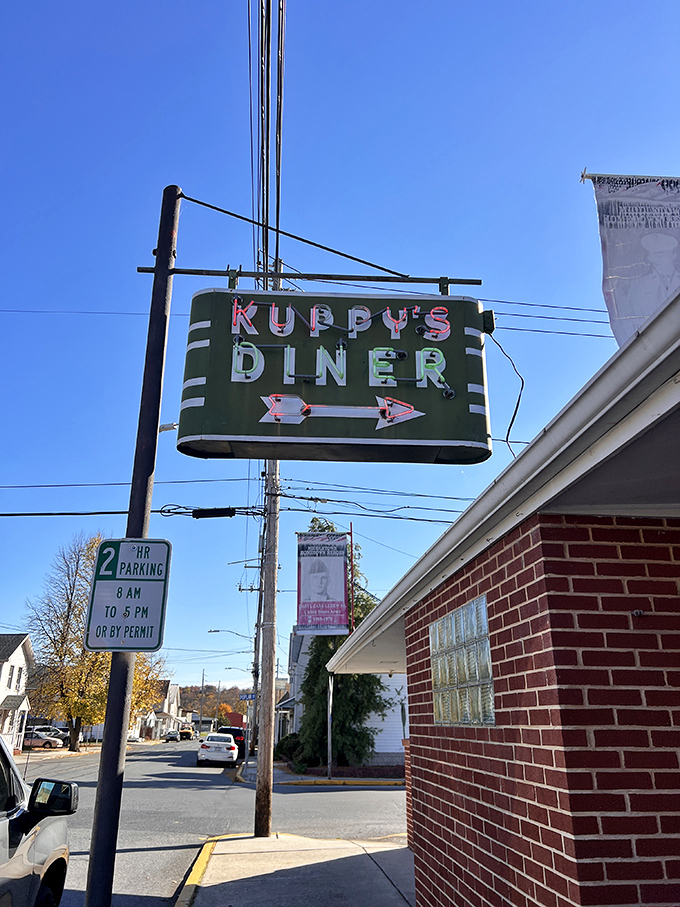 The vintage neon sign points the way like a beacon of hope for the hungry, promising simple pleasures in an increasingly complicated world.