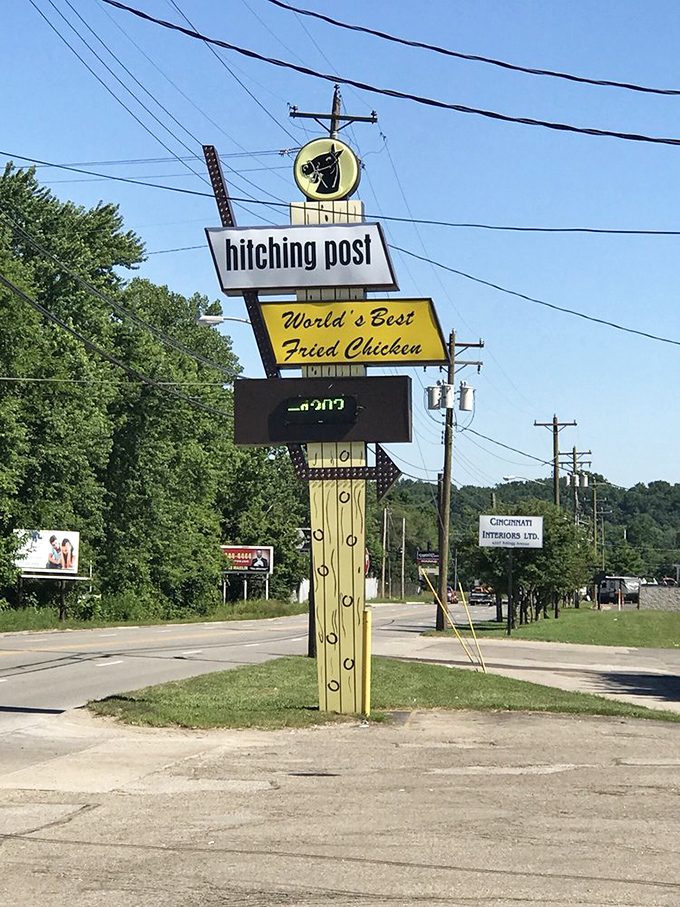 The iconic roadside sign beckoning hungry travelers like a golden lighthouse for those lost in a sea of mediocre fast food.