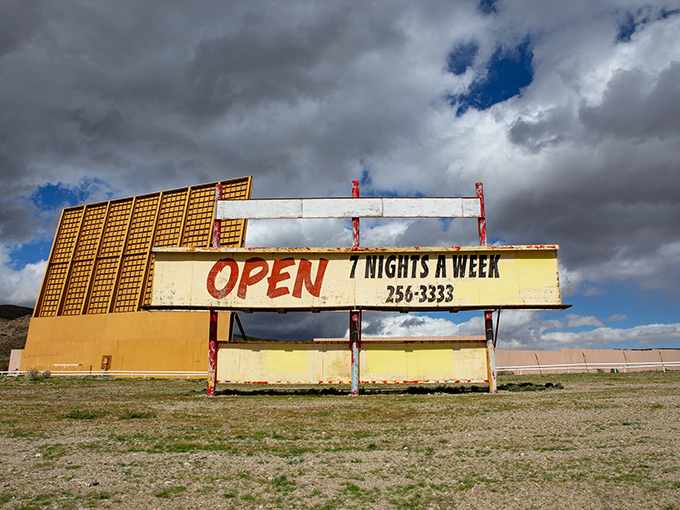 "OPEN 7 NIGHTS A WEEK" - the weathered marquee stands as a testament to the enduring appeal of outdoor cinema.