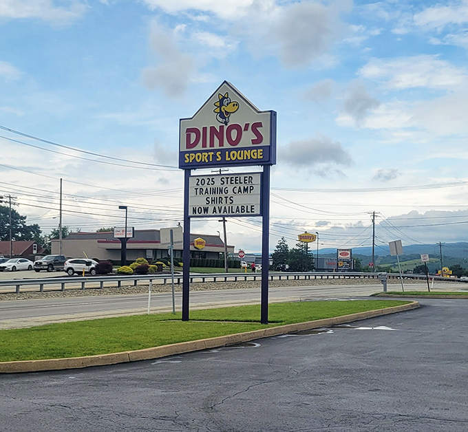 The beacon that guides hungry travelers home &ndash; Dino's sign stands tall against the Pennsylvania sky, promising comfort and satisfaction.