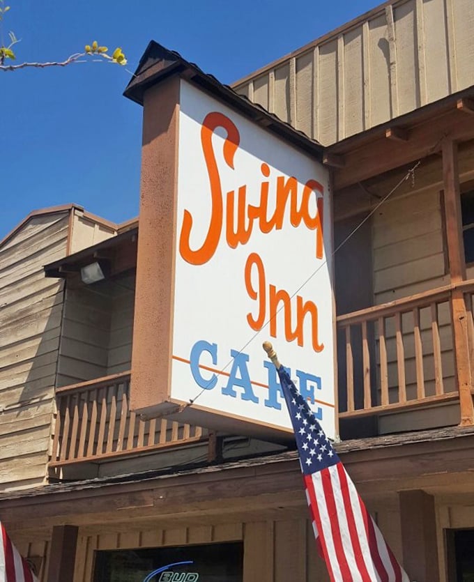 That iconic orange script sign with an American flag&mdash;because nothing says "classic American eatery" quite like patriotism and good typography.