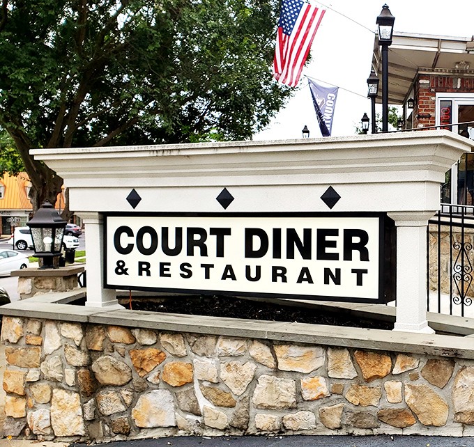 The sign stands as a beacon of hope for the hungry, promising classic American comfort in a world of fleeting food trends.
