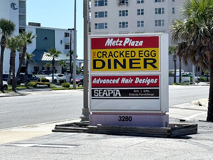 Nestled in Metz Plaza, this sign guides hungry travelers to breakfast nirvana. Follow it like a breakfast beacon.