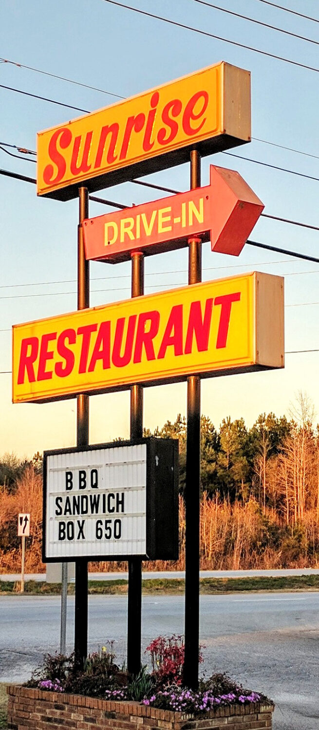 That vintage sign stands tall against the Carolina sky, a yellow and red landmark that's guided hungry travelers like a lighthouse for those lost in a sea of chain restaurants.