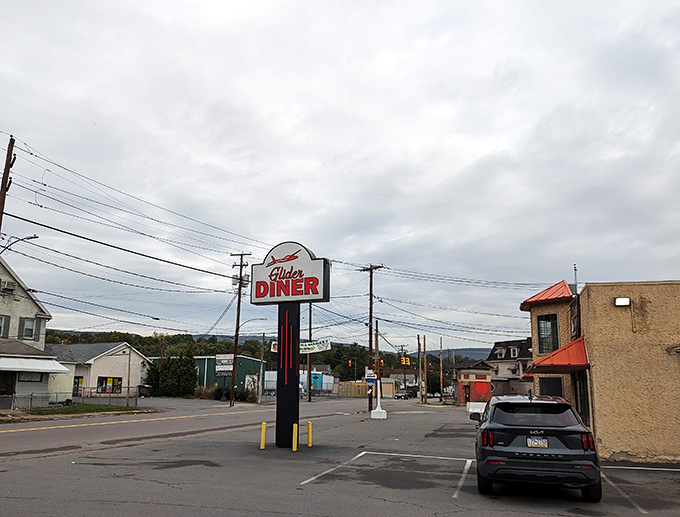 The roadside sign stands tall against Pennsylvania skies, a landmark for locals and a discovery for lucky travelers.