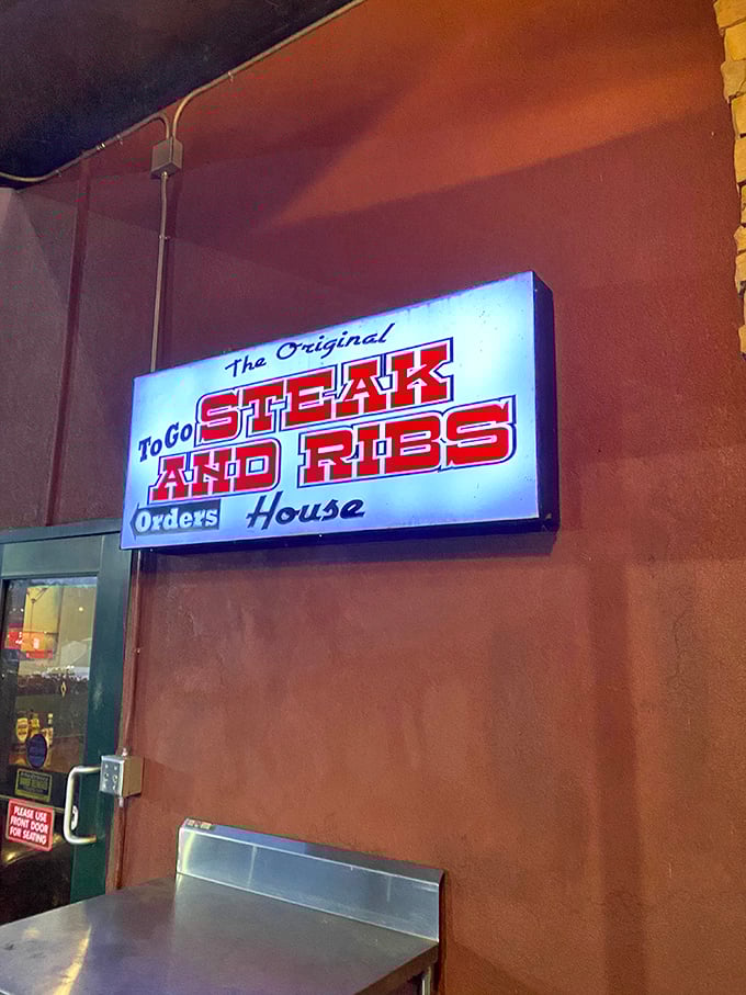 Even the to-go sign glows with promise&mdash;because sometimes the best dining room is your own couch, pants unbuttoned, dignity optional.