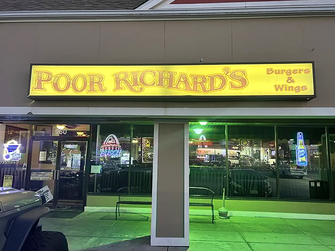 The illuminated sign shines like a beacon of hope for empty stomachs. Poor Richard's may be the name, but rich flavors await inside.