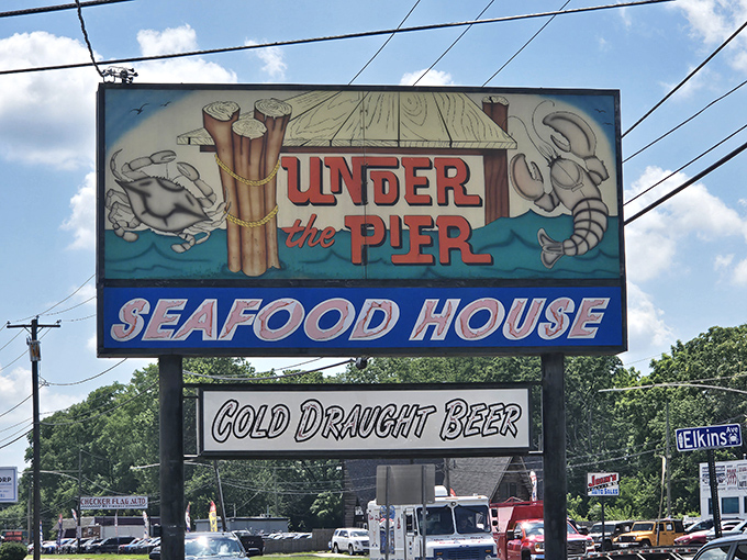 The roadside sign beckons like a lighthouse to hungry travelers&mdash;"Cold Draught Beer" being the perfect supporting actor to the seafood star.