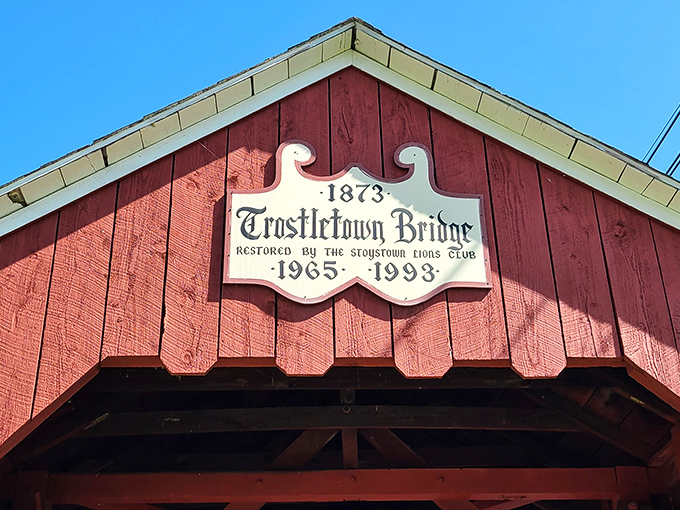 "1873" proclaims the sign, revealing the bridge's impressive longevity. Restored by the Stoystown Lions Club, this landmark continues to connect past with present.