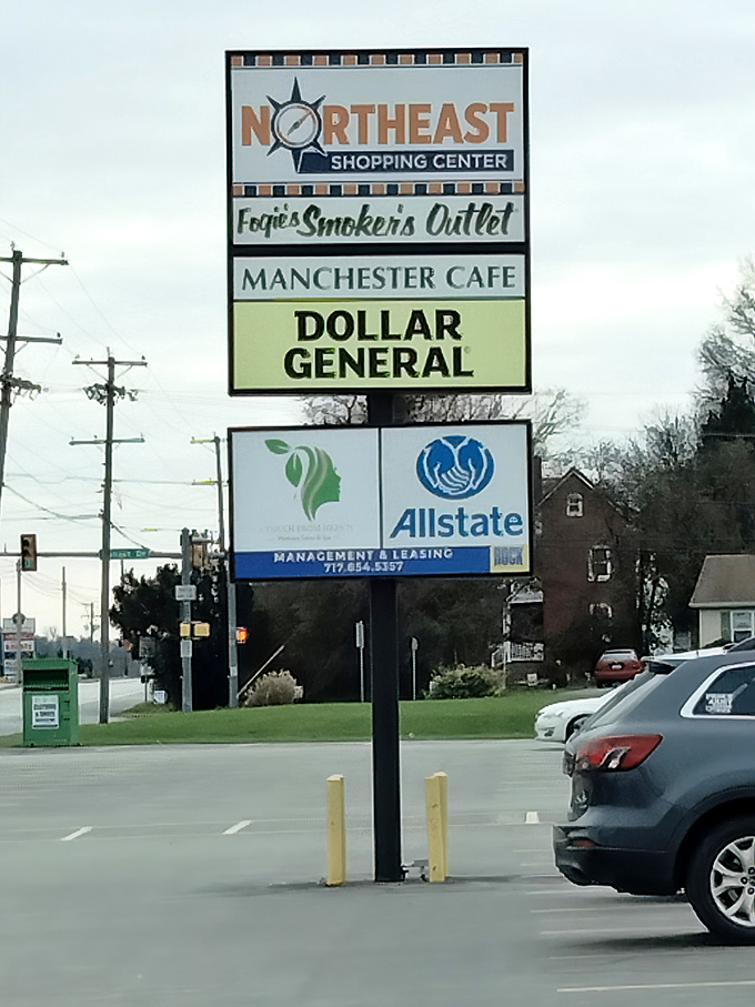 The shopping center sign stands as a beacon for hungry travelers&mdash;follow it to find breakfast bliss hiding between Dollar General and Allstate.