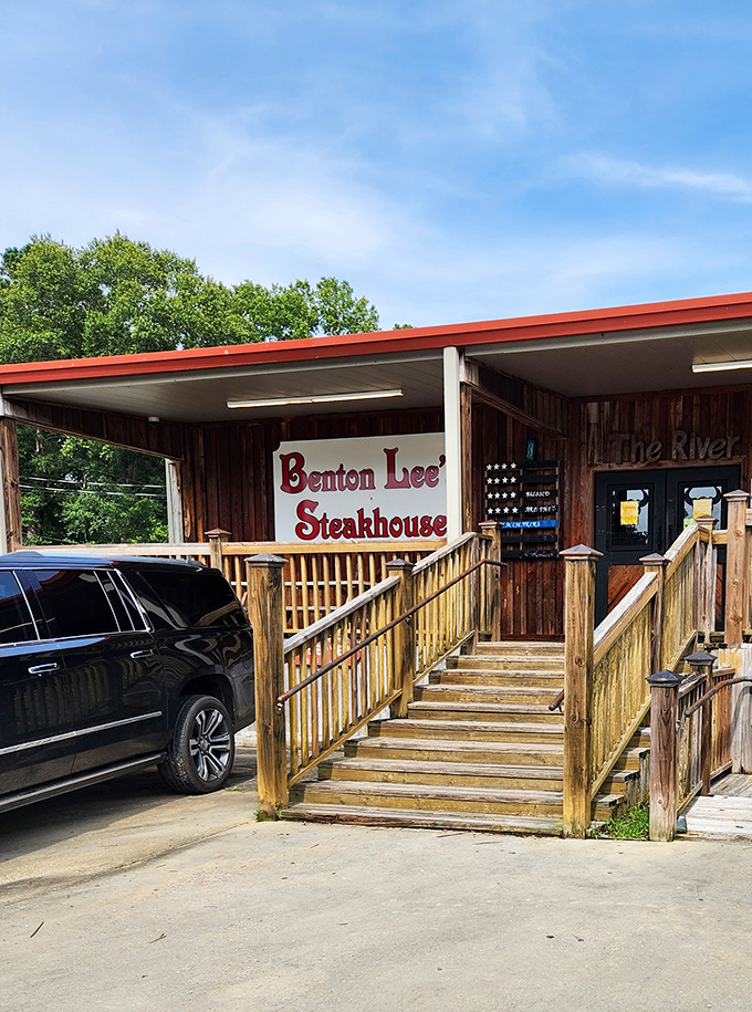 The welcoming wooden steps and bold red signage serve as a beacon for hungry travelers. Your stomach starts growling before you even park.