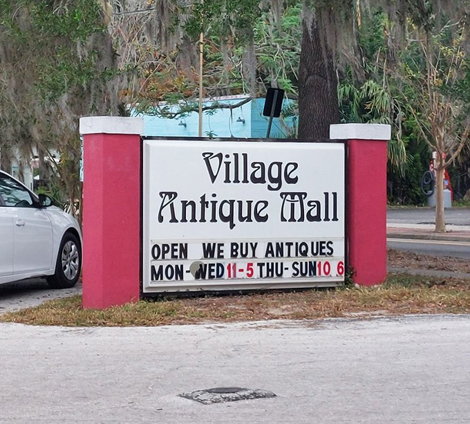 The sign says it all&mdash;Village Antique Mall welcomes visitors six days a week. Those Spanish moss-draped trees add the perfect Florida frame.