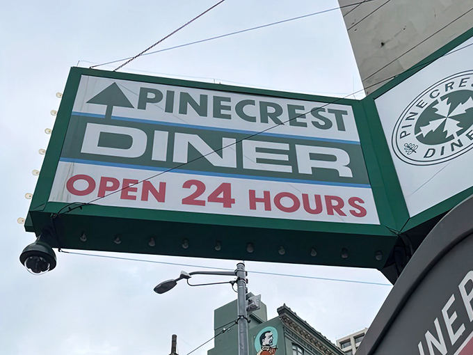 The classic diner sign stands proud against the San Francisco sky, a monument to meals done right around the clock.