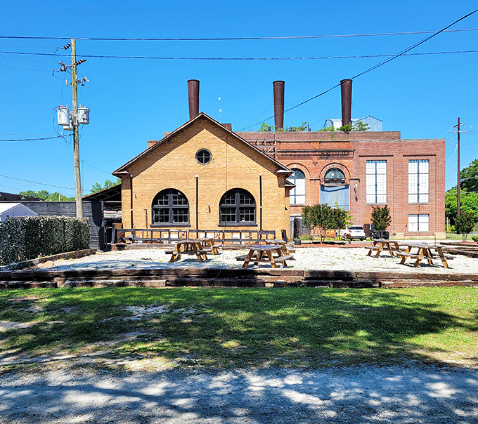 This charming industrial building with picnic tables invites you to linger longer. The kind of casual outdoor space where afternoon easily slips into evening. 