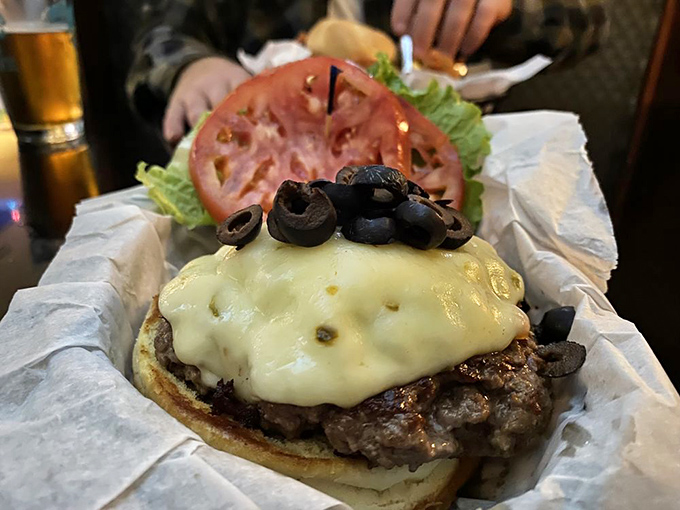 The Spanish Burger topped with melted cheese and black olives proves that Blue Moon knows how to elevate the humble hamburger into something special.
