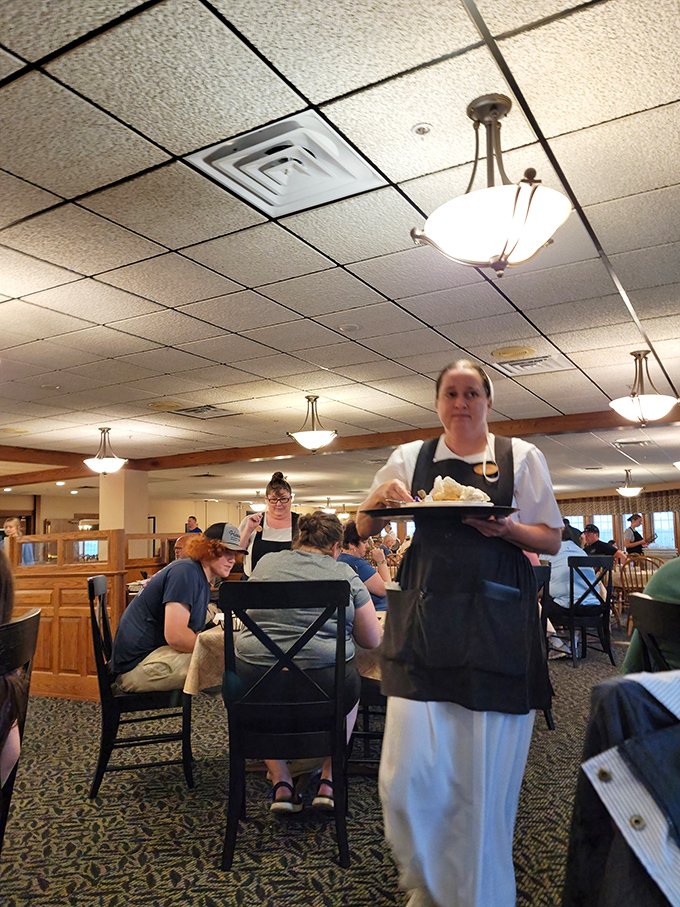 Servers move with practiced efficiency, delivering plates that make everyone at the table experience momentary food envy.