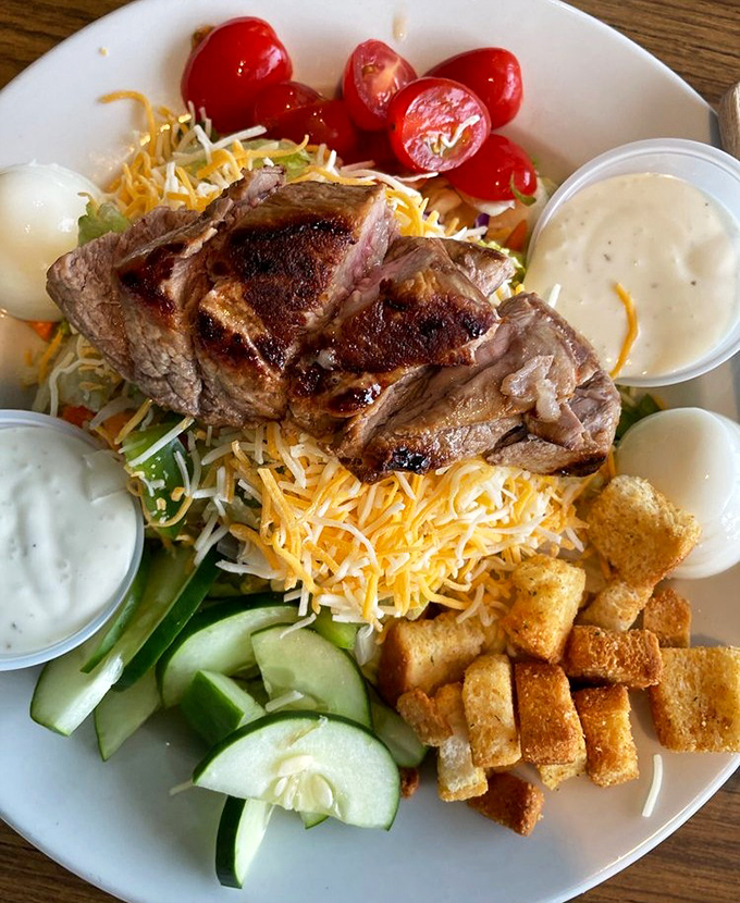 This steak salad isn't playing around&mdash;it's bringing serious protein to what could have been a mere rabbit food situation, with croutons standing guard like crunchy sentinels.