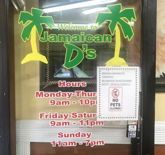 The hours posted clearly because they understand: when the craving for Caribbean cuisine hits, you need to know exactly when relief is available.