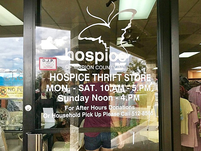 The store's welcoming entrance announces generous hours for both shopping and donations, inviting the community to participate in this cycle of giving.