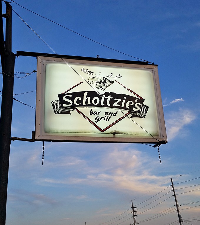 The vintage sign featuring a moose silhouette stands as a beacon for the hungry and adventurous&mdash;a landmark of local culinary tradition.