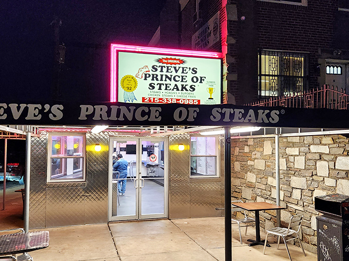 As night falls, the illuminated sign becomes a lighthouse for the hungry, guiding sandwich seekers to their late-night salvation.