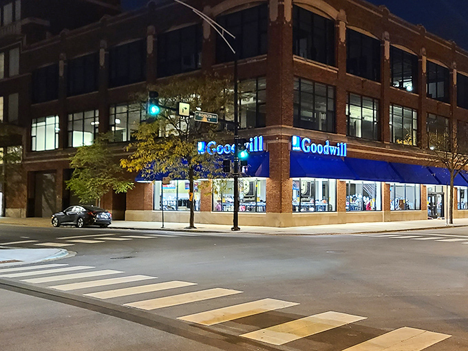 After dark, the Goodwill glows like a beacon of bargain possibilities, plotting tomorrow's treasure hunt while Chicago sleeps.