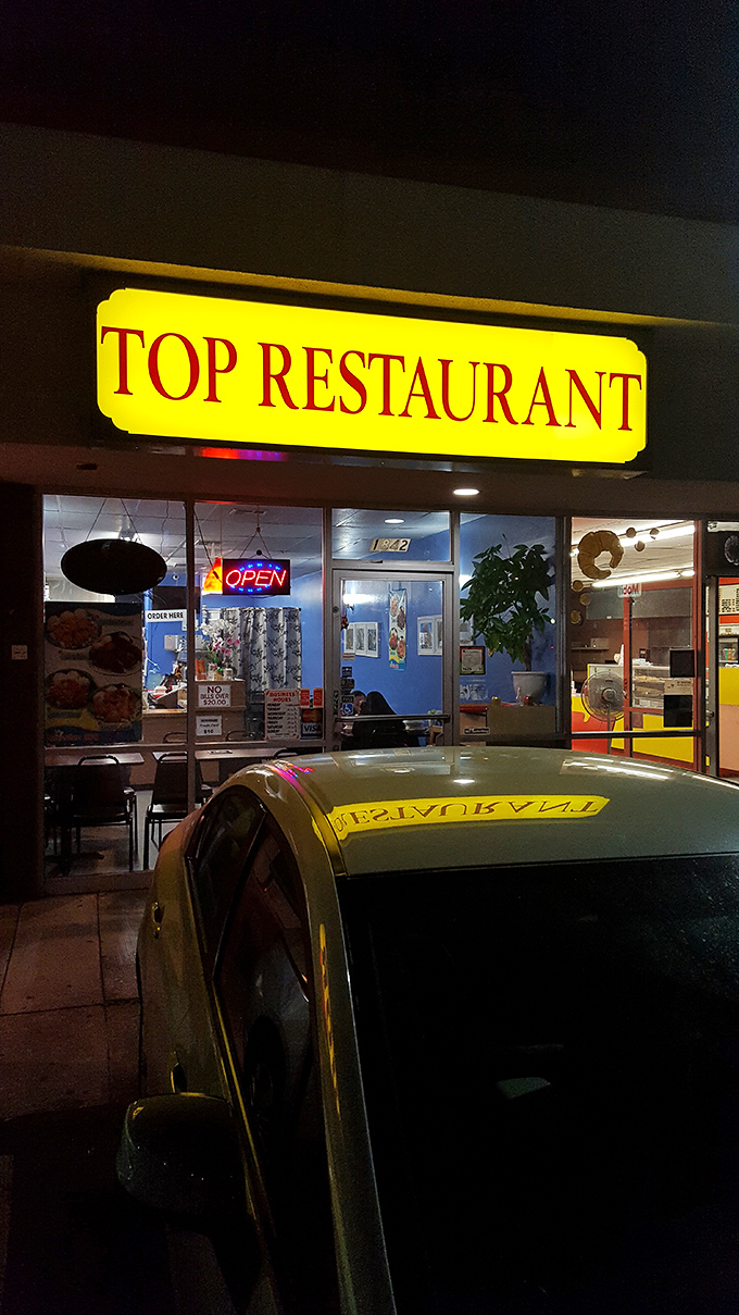 The yellow sign glows like a beacon in the night, guiding hungry souls to flavor salvation when evening cravings strike.