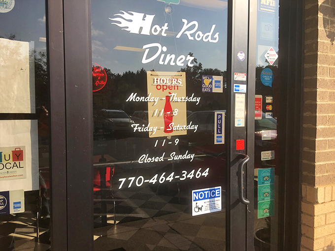 Hours posted on the door&mdash;a gentle reminder that even perfection needs a day off, so plan your country fried steak cravings accordingly.