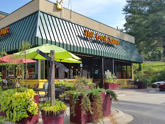 The welcoming exterior with lush planters creates curb appeal that matches the food appeal &ndash; a preview of the colorful flavors waiting inside.